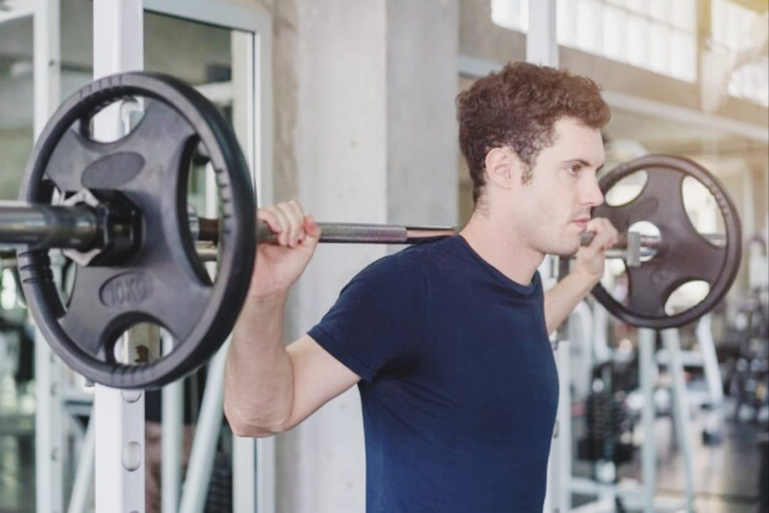 Should my head look forward or down when squatting?